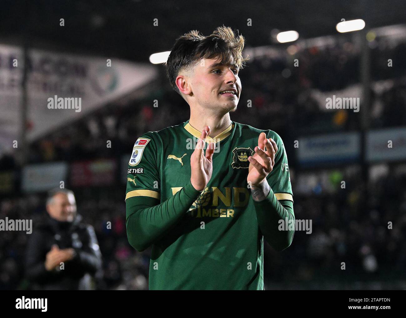 Luke Cundle #28 of Plymouth Argyle celebrates a win at full time during ...