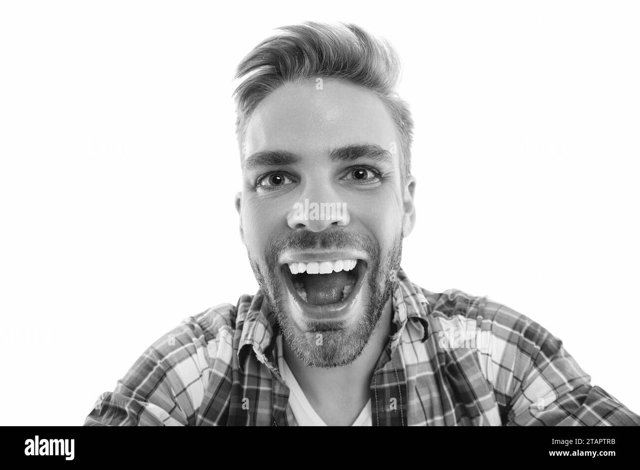 happy selfie man in studio. photo of selfie man wearing checkered shirt ...