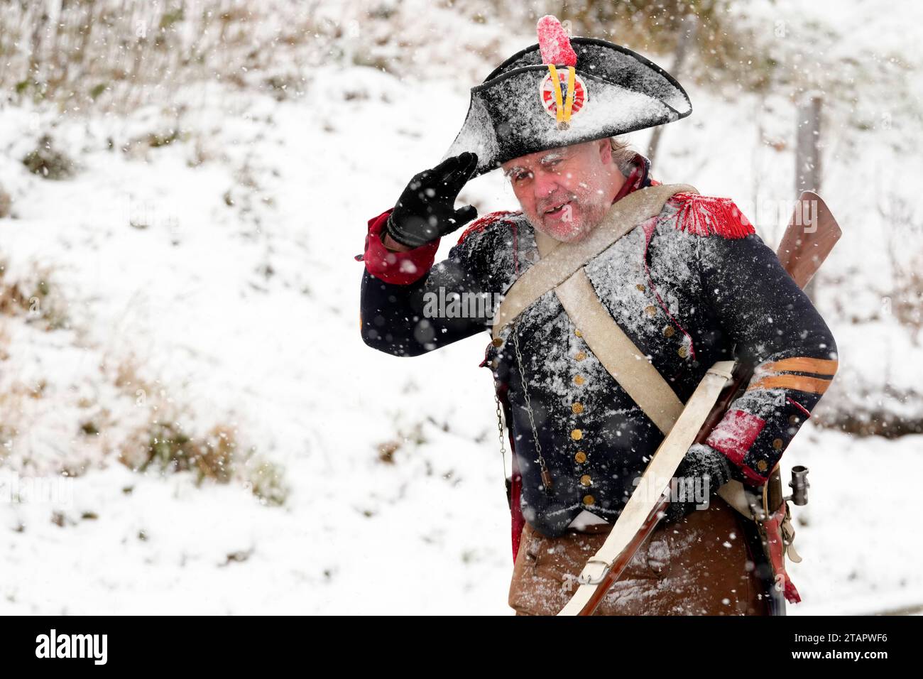 History enthusiast dressed in regimental costume salutes before a re ...