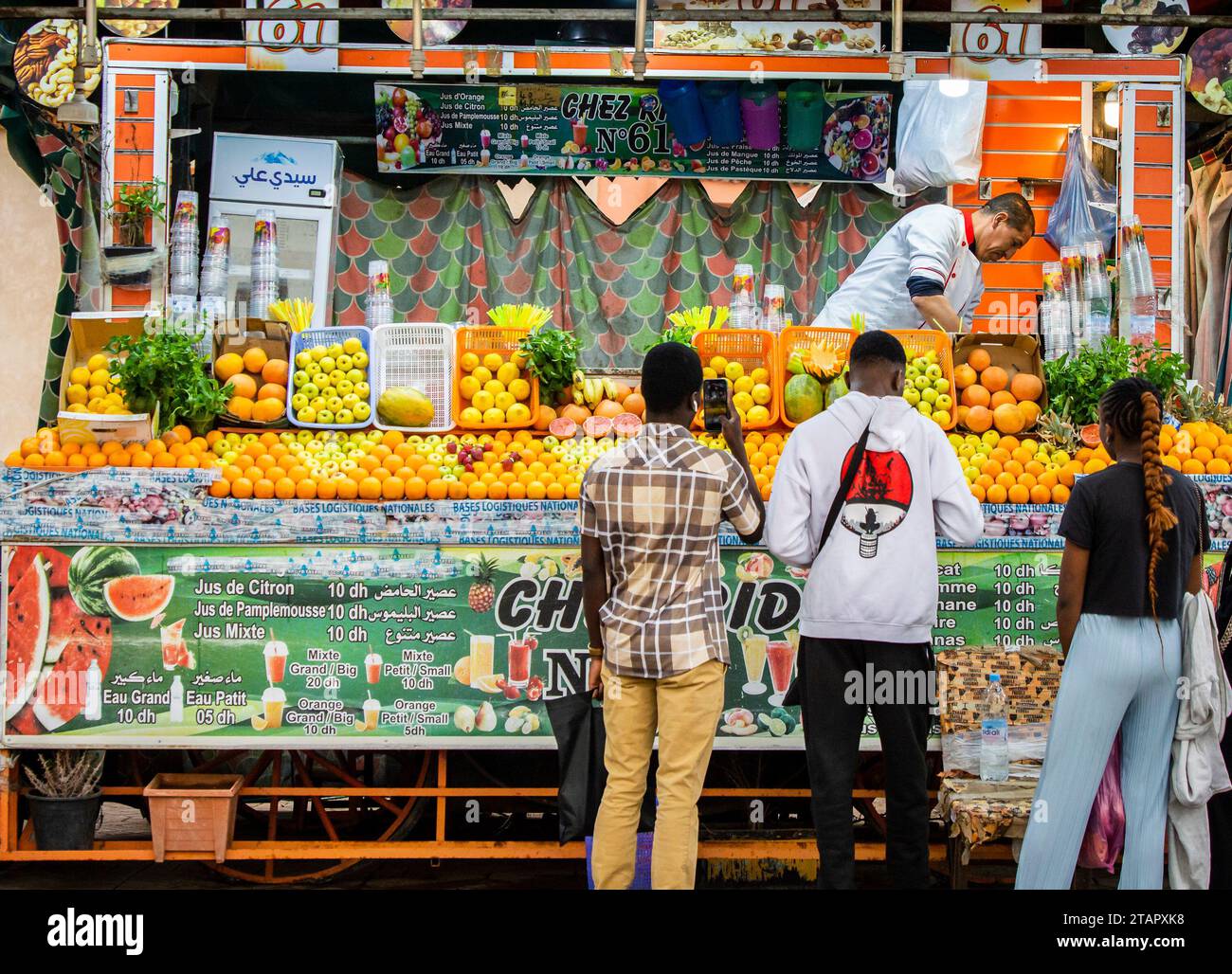 Marrakech, Morocco, April 8th, 2023. A Moroccan male vendor preparing ...
