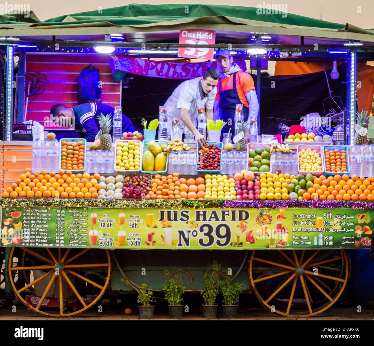 Marrakech, Morocco, April 8th, 2023. A Moroccan male vendor preparing ...