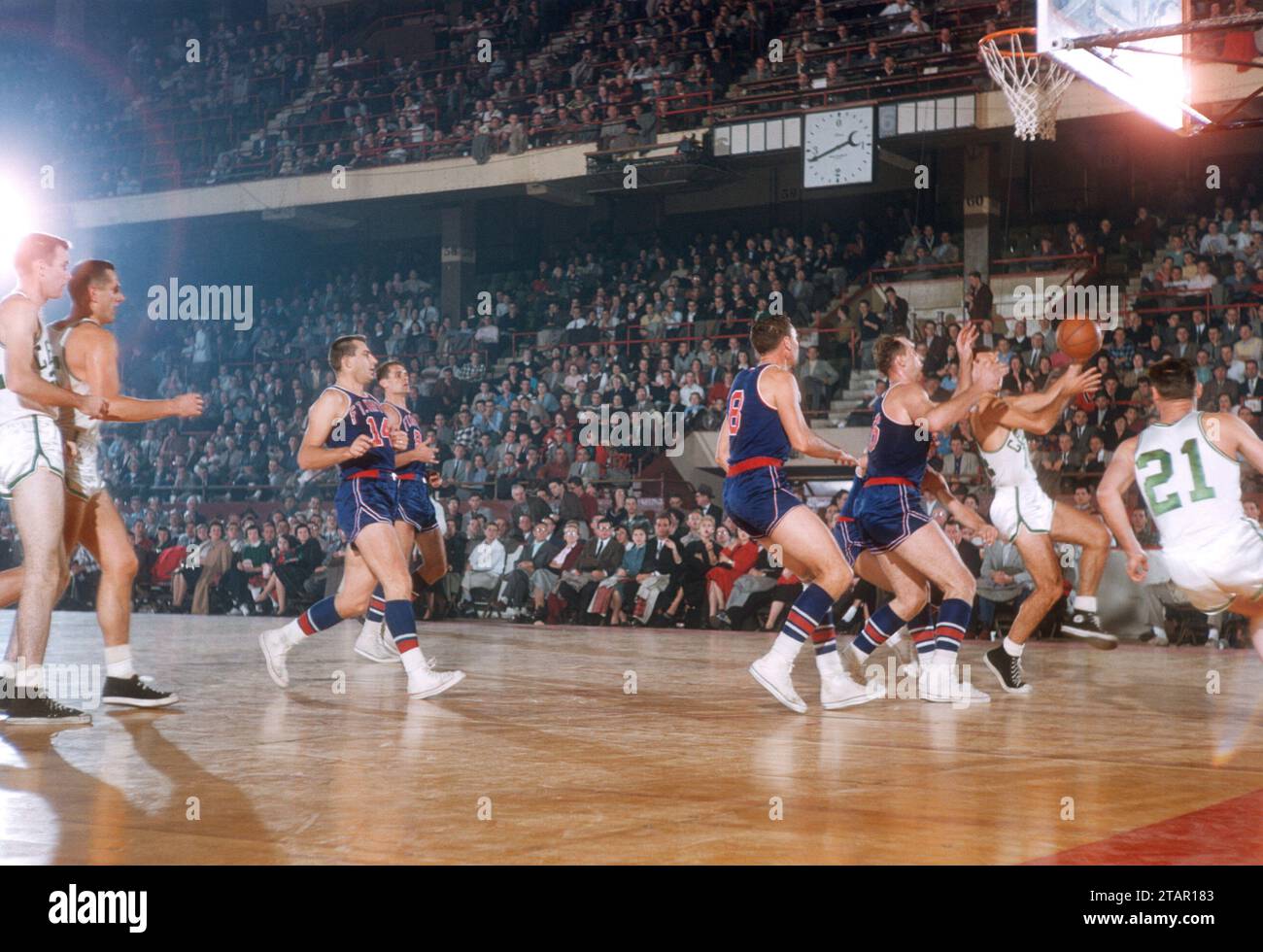 BOSTON, MA - 1957: Bob Cousy #14 of the Boston Celtics goes for the ...