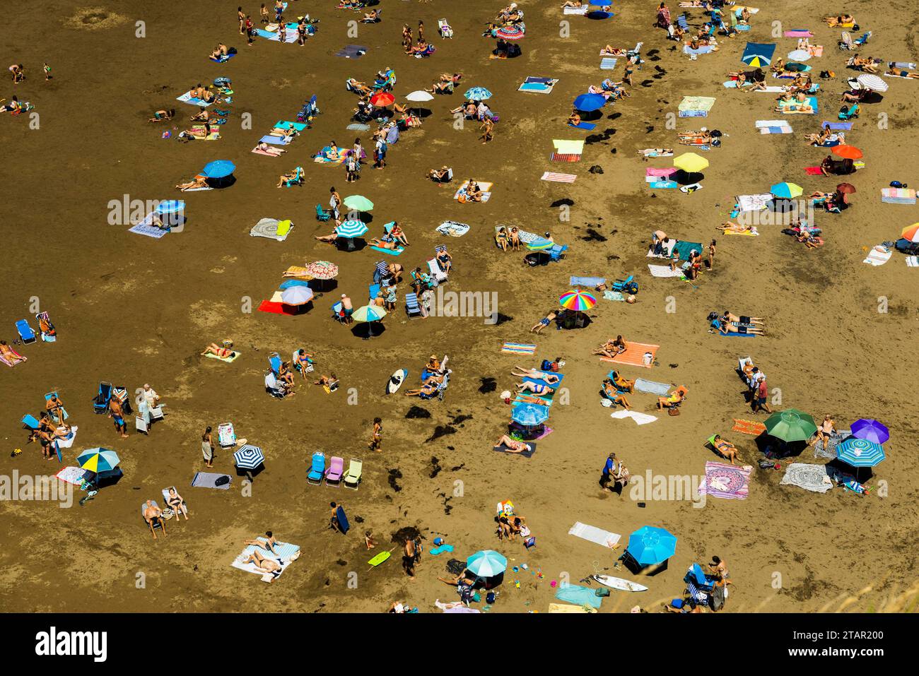 People on the beach, bird's eye view, Zumaia, near San Sebastian ...