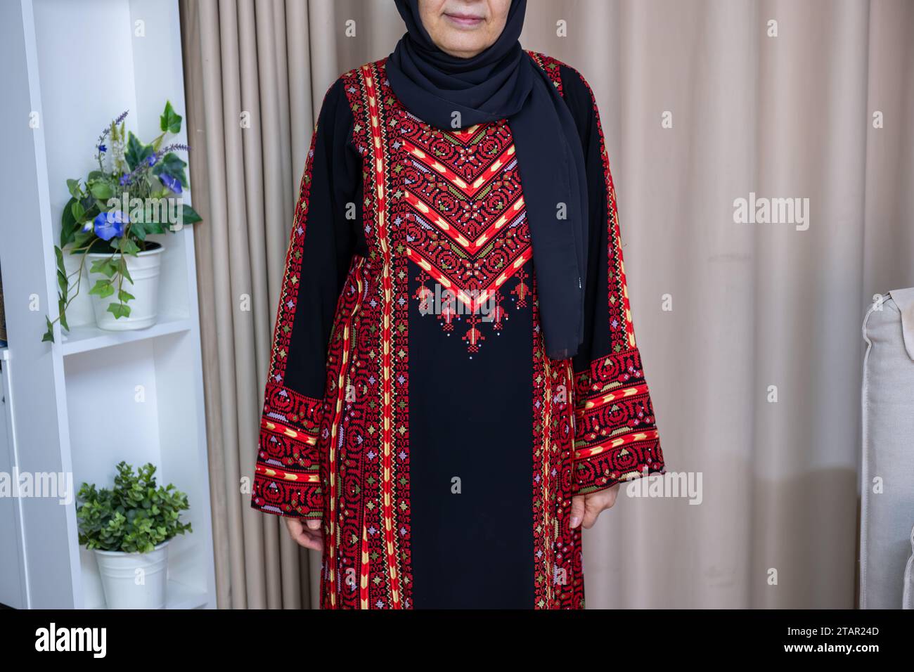 Female wearing palestinian traditional clothes indoor Stock Photo - Alamy
