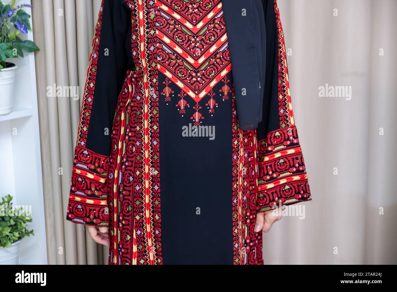 Female wearing palestinian traditional clothes indoor Stock Photo - Alamy