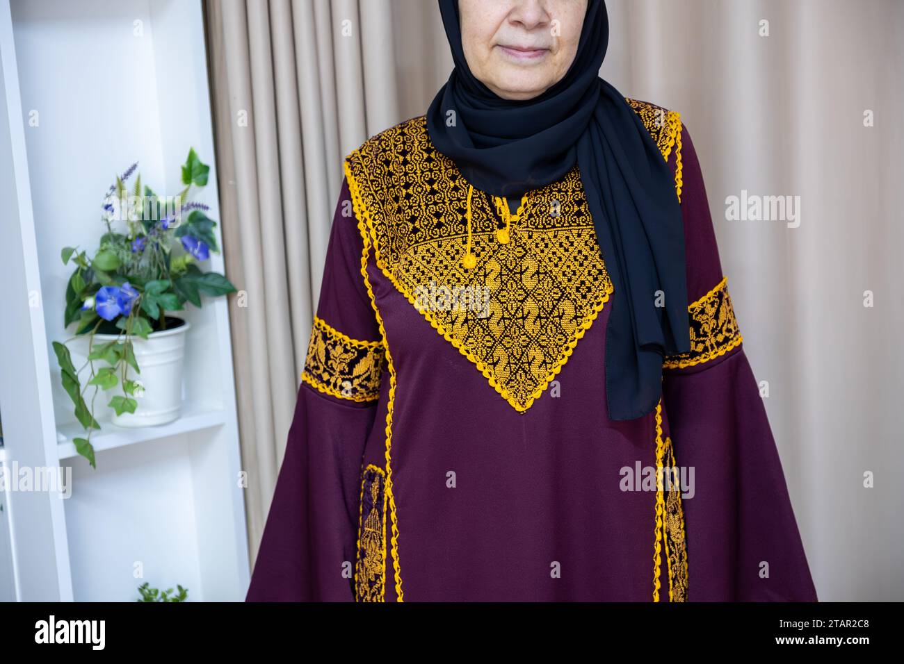 Female wearing palestinian traditional clothes indoor Stock Photo - Alamy