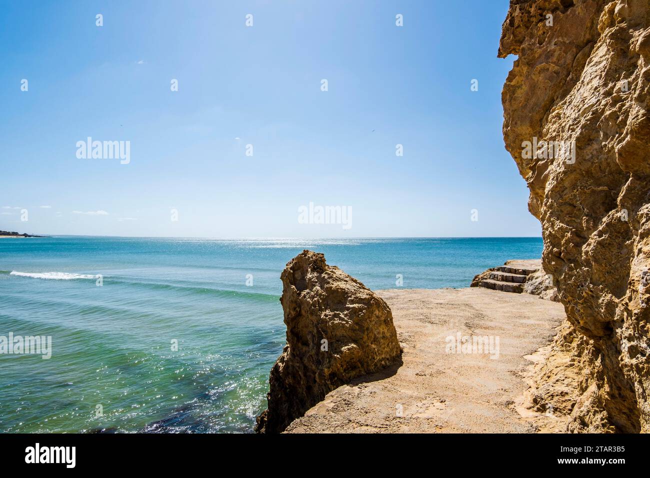 Awesome view of Albufeira cliff with side walk, blue sky, atlantic sea ...