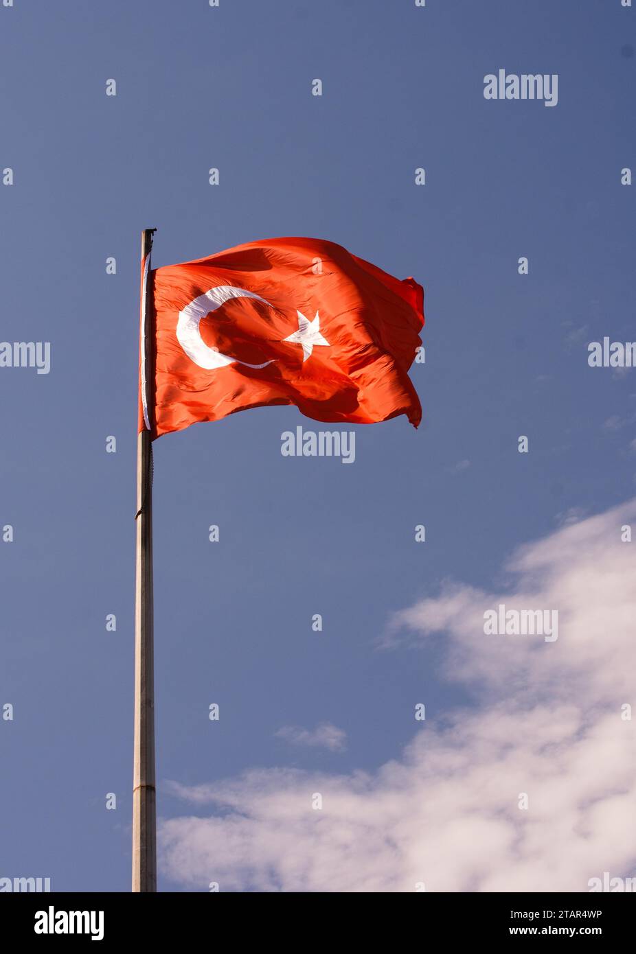 Turkish national flag with white star and moon on a pole in sky Stock ...
