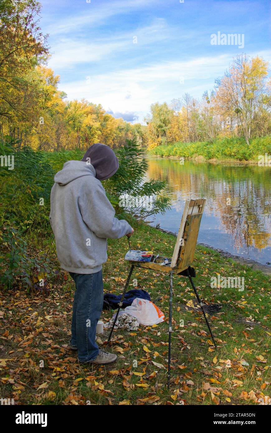 Man painting on his canvas in nature Stock Photo - Alamy