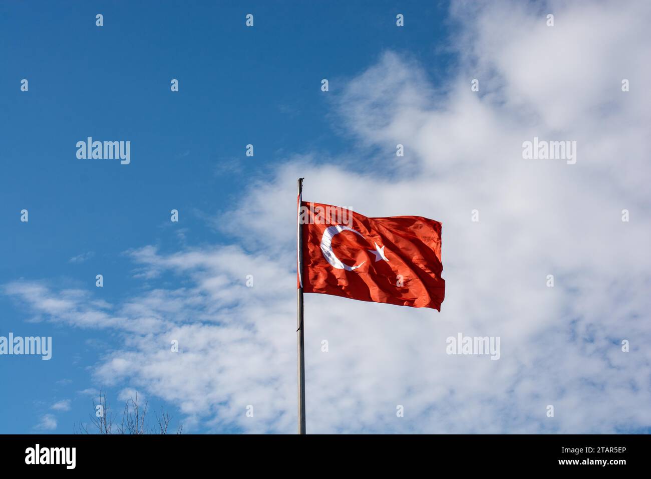 Turkish national flag with white star and moon on a pole in sky Stock ...