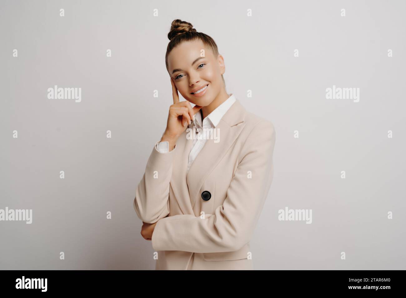 Smart female business posing isolated over grey background Stock Photo ...