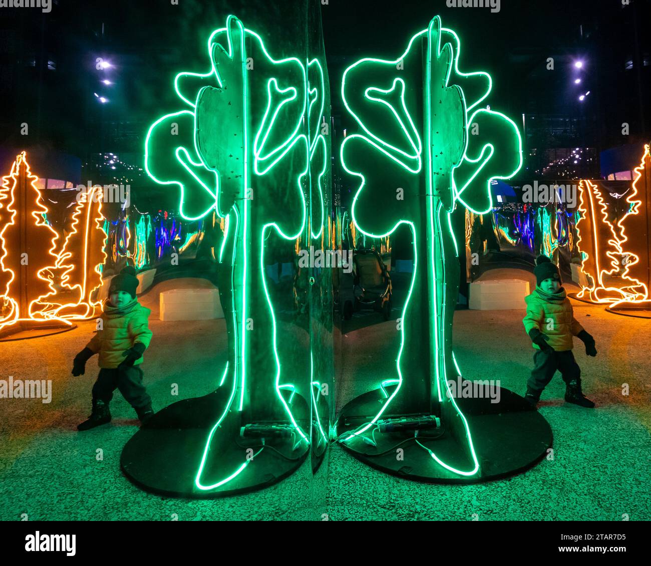 London, UK. 2 December 2023. Visitors enjoy The Luminaze, a new light ...