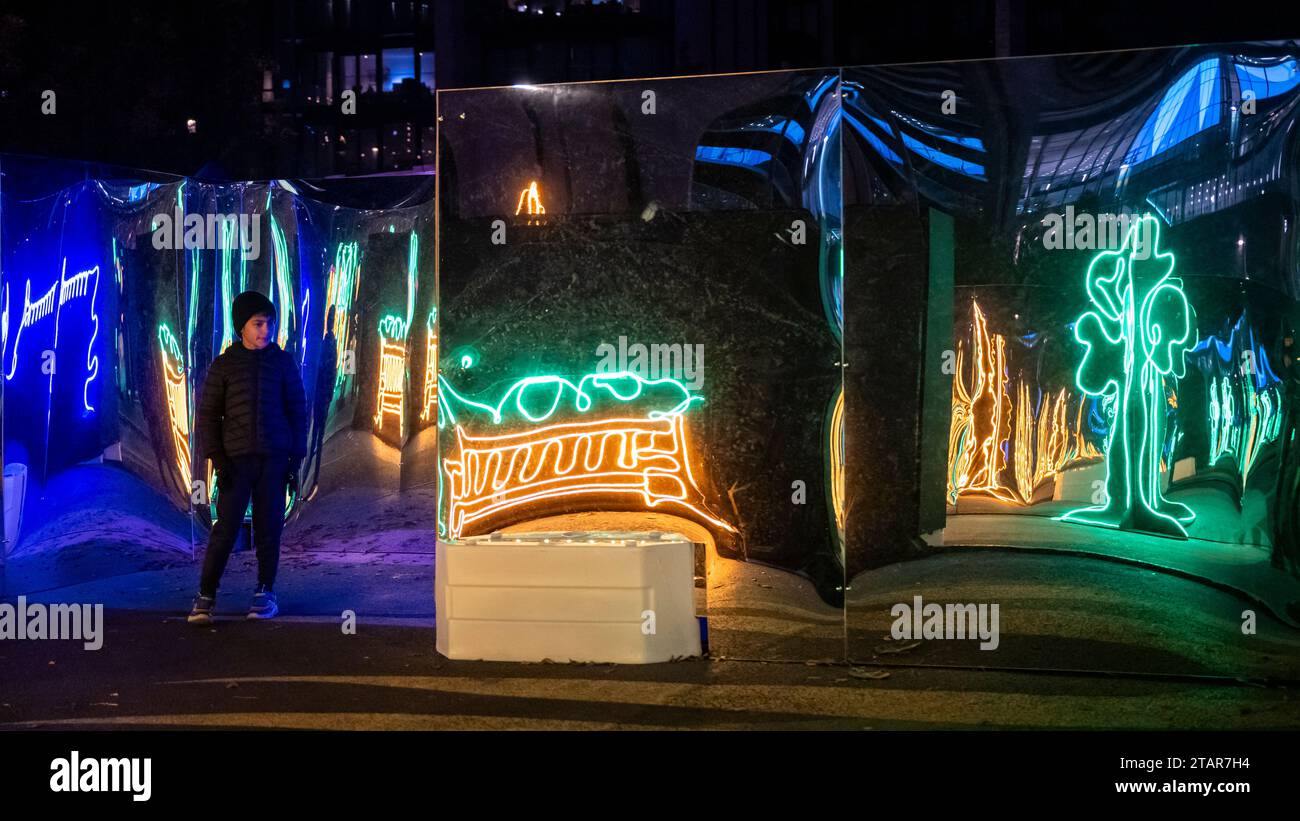 London, UK. 2 December 2023. Visitors enjoy The Luminaze, a new light ...