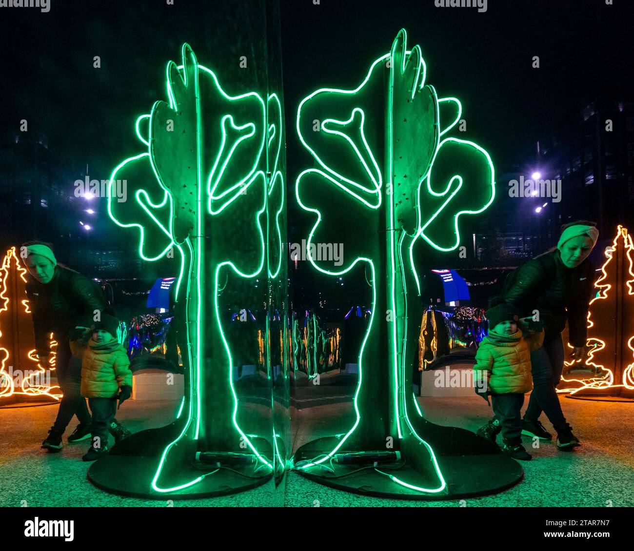 London, UK. 2 December 2023. Visitors enjoy The Luminaze, a new light ...