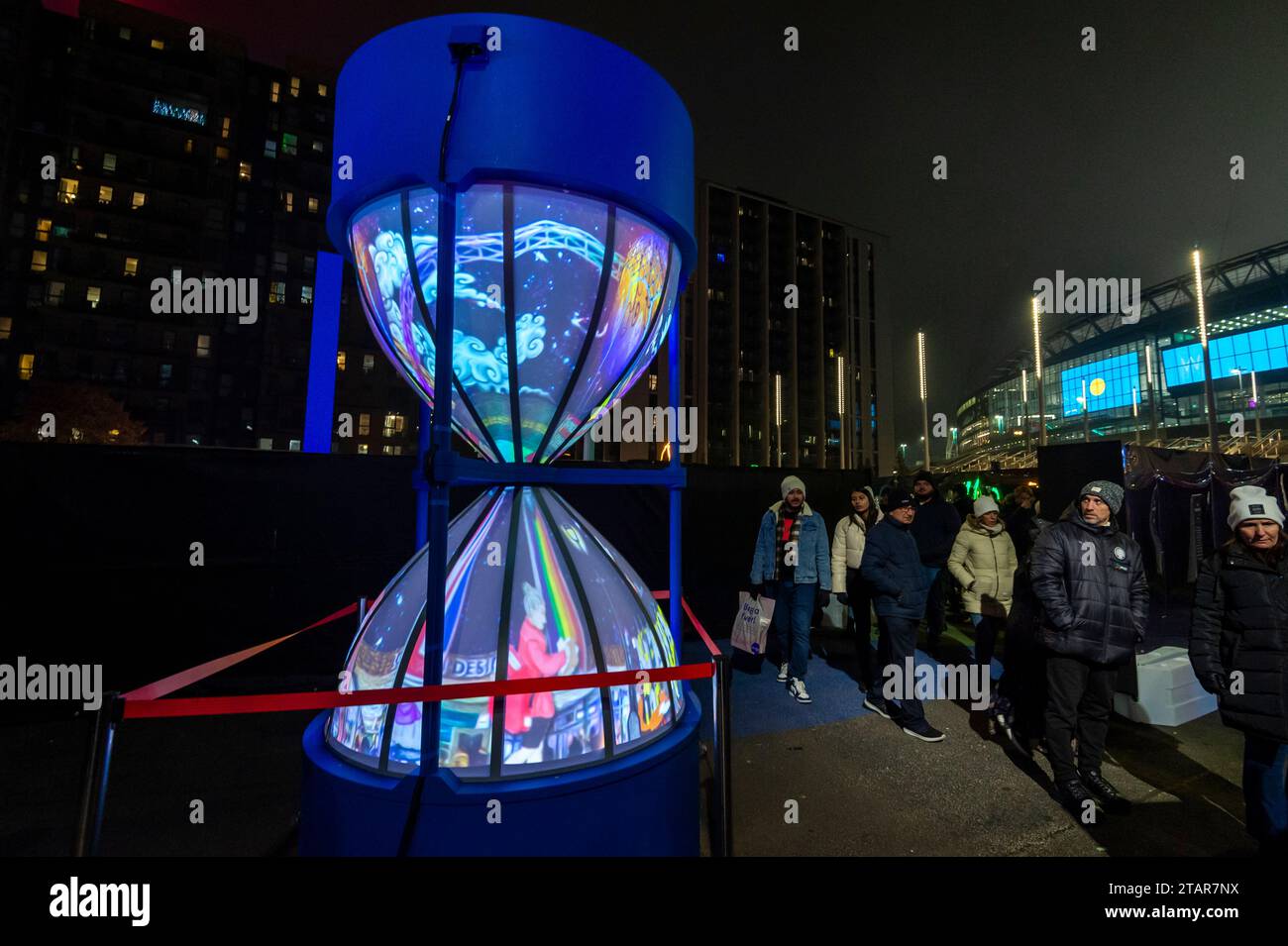 London, UK. 2 December 2023. Visitors enjoy The Luminaze, a new light ...