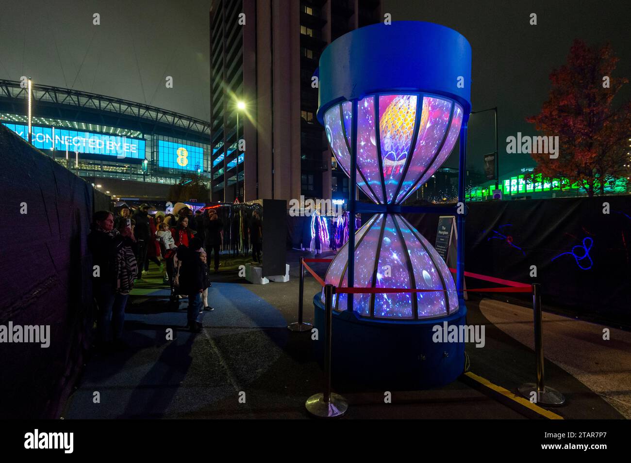 London, UK. 2 December 2023. Visitors enjoy The Luminaze, a new light ...