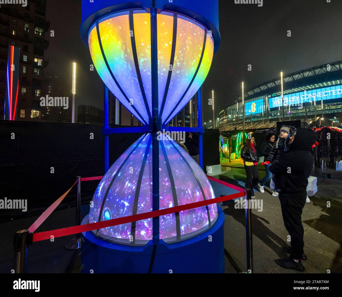 London, UK. 2 December 2023. Visitors enjoy The Luminaze, a new light ...