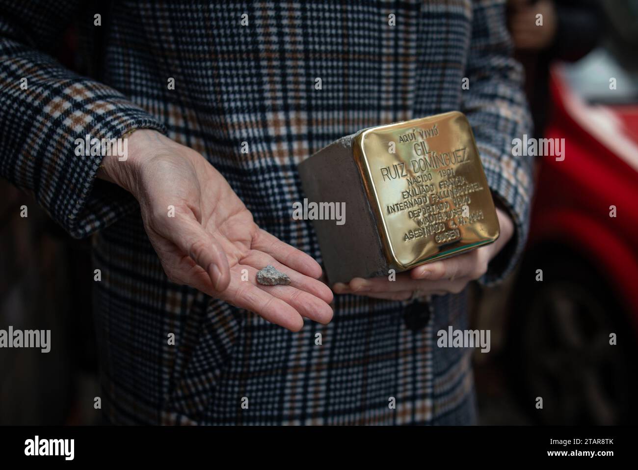 Madrid, Spain. 01st Dec, 2023. A participant holds a Stolpersteine ...