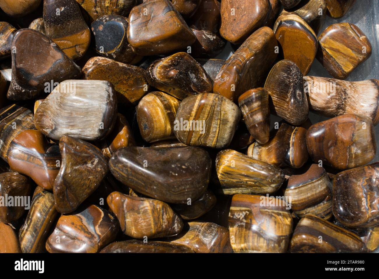 Tiger's eye and hawk's eye gemstone as natural mineral rock specimen ...