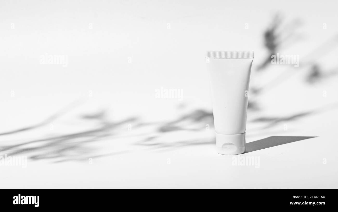 White blank cream tube mockup on banner background. Small cosmetic ...