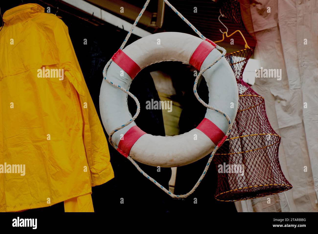 Lifesaver or life preserver with rope around for a drowning person to ...