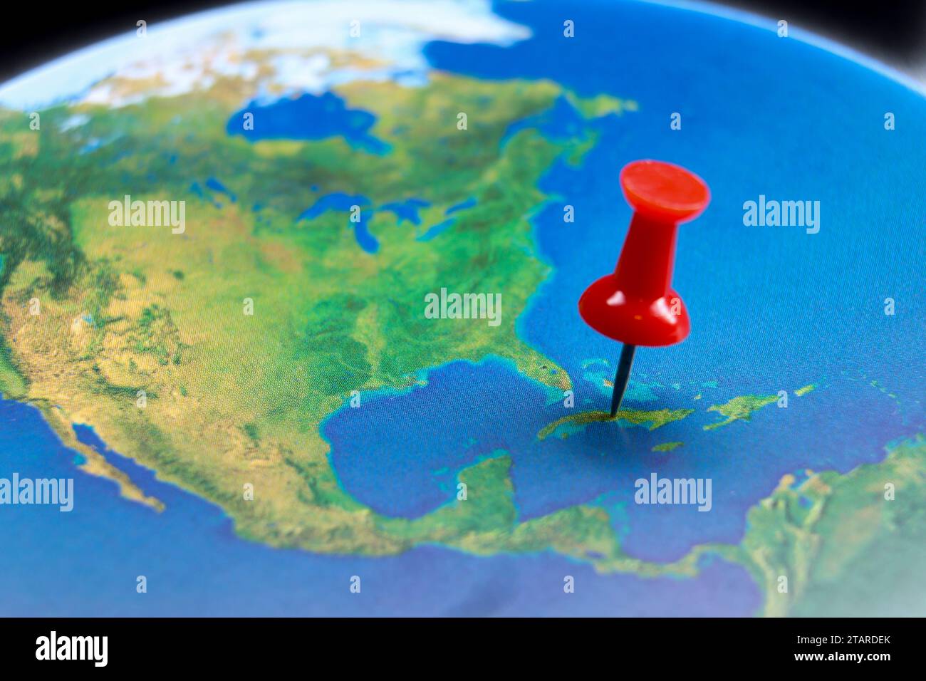 Cuba pin on a globe map Stock Photo - Alamy