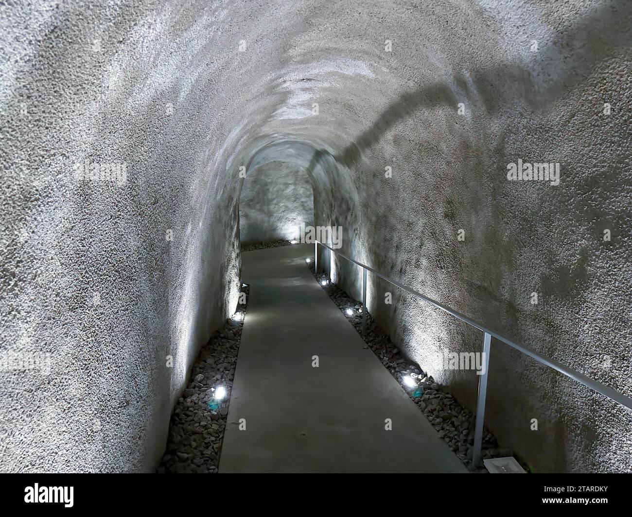 Walkway with Railing in an Illuminated Underground Tunnel in ...