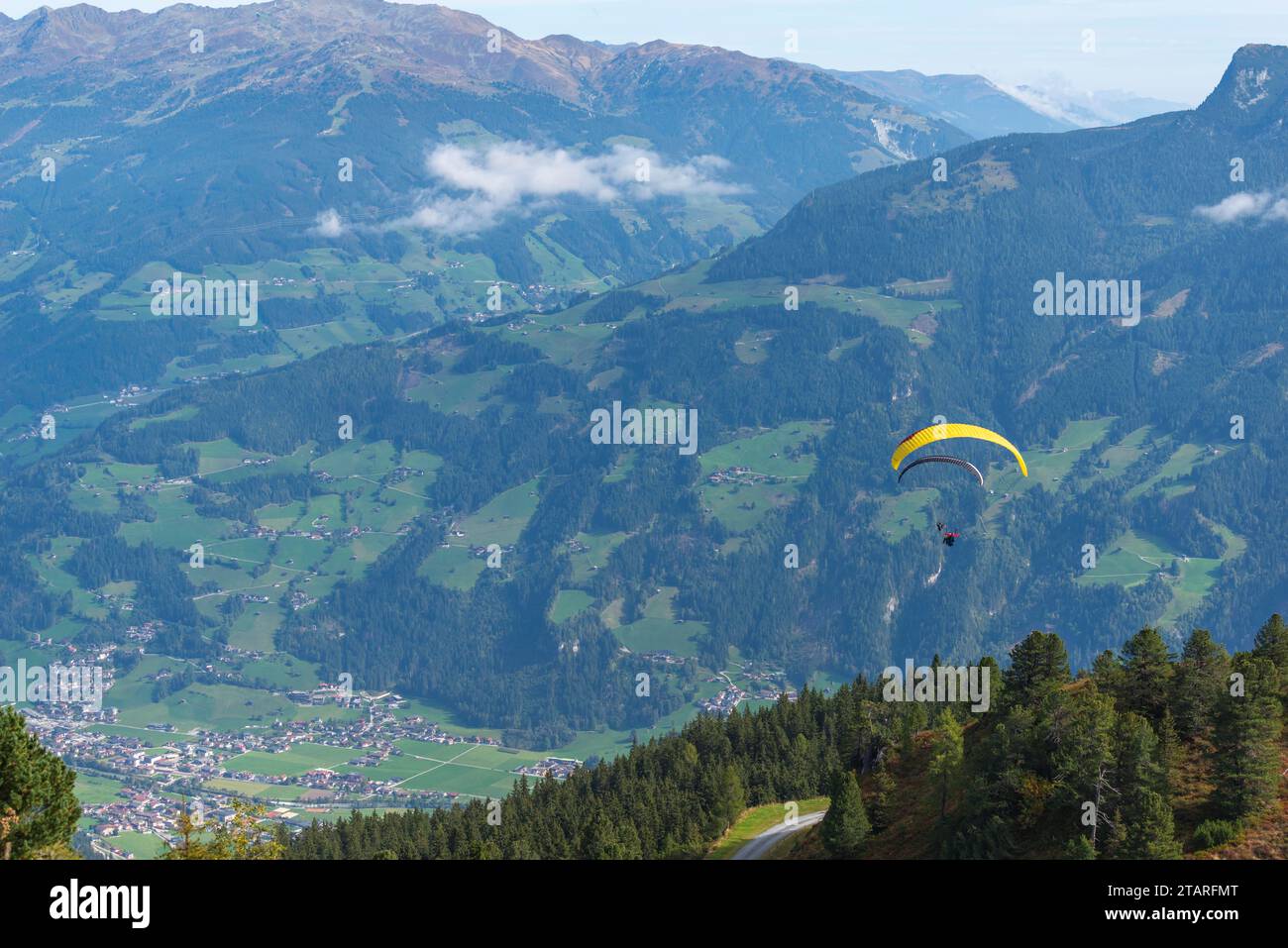 Tandem paragliding flight, Penken, Mayrhofen, Zillertal Alps, alpine pastures, alpine mountain ...