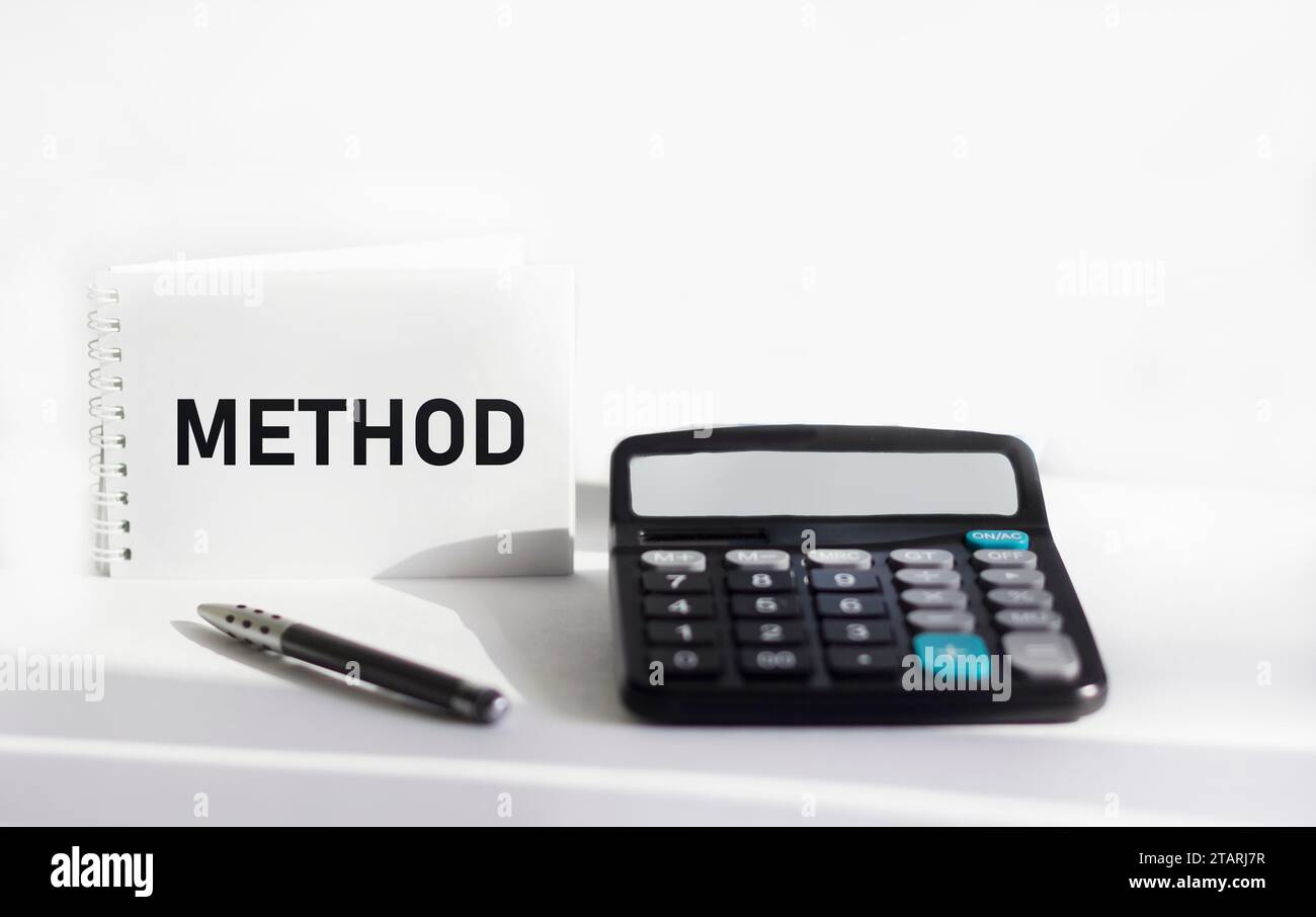 Notepad with the text Method lies on a white background with a ...