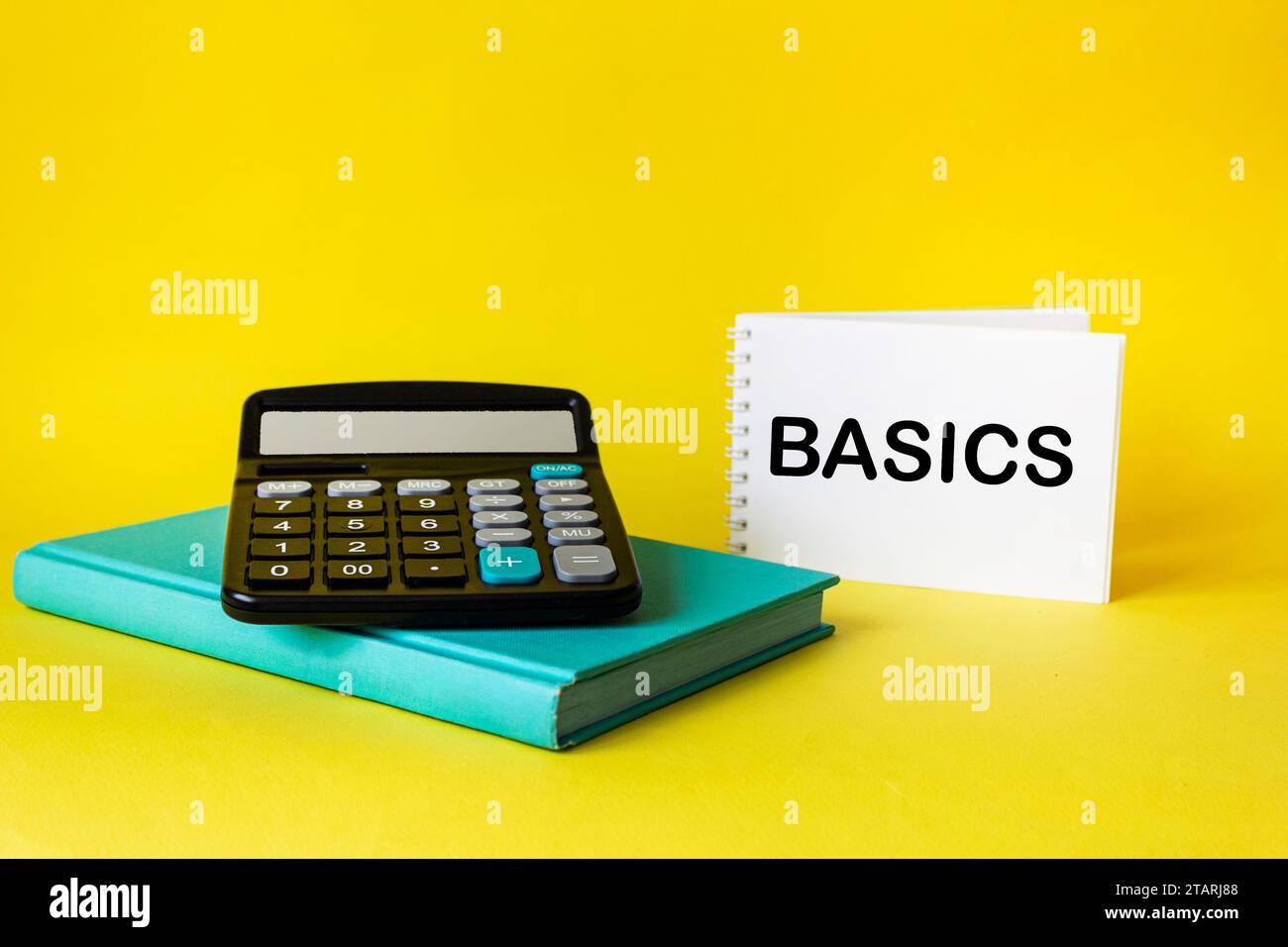 The word BASICS written on a notepad and yellow background Stock Photo ...