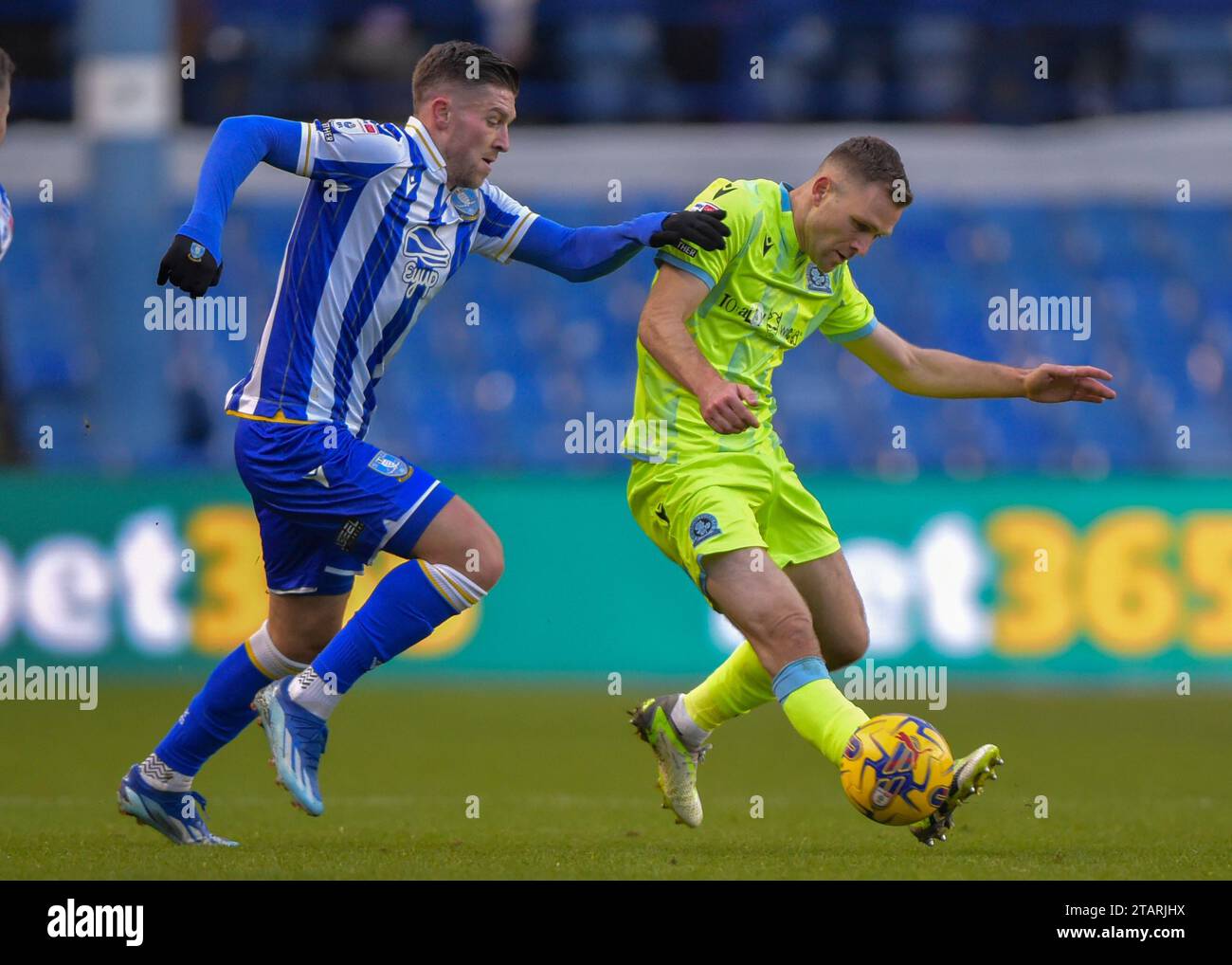 Sondre Tronstad #6 of Blackburn Rovers passes round Josh Windass #11 of ...