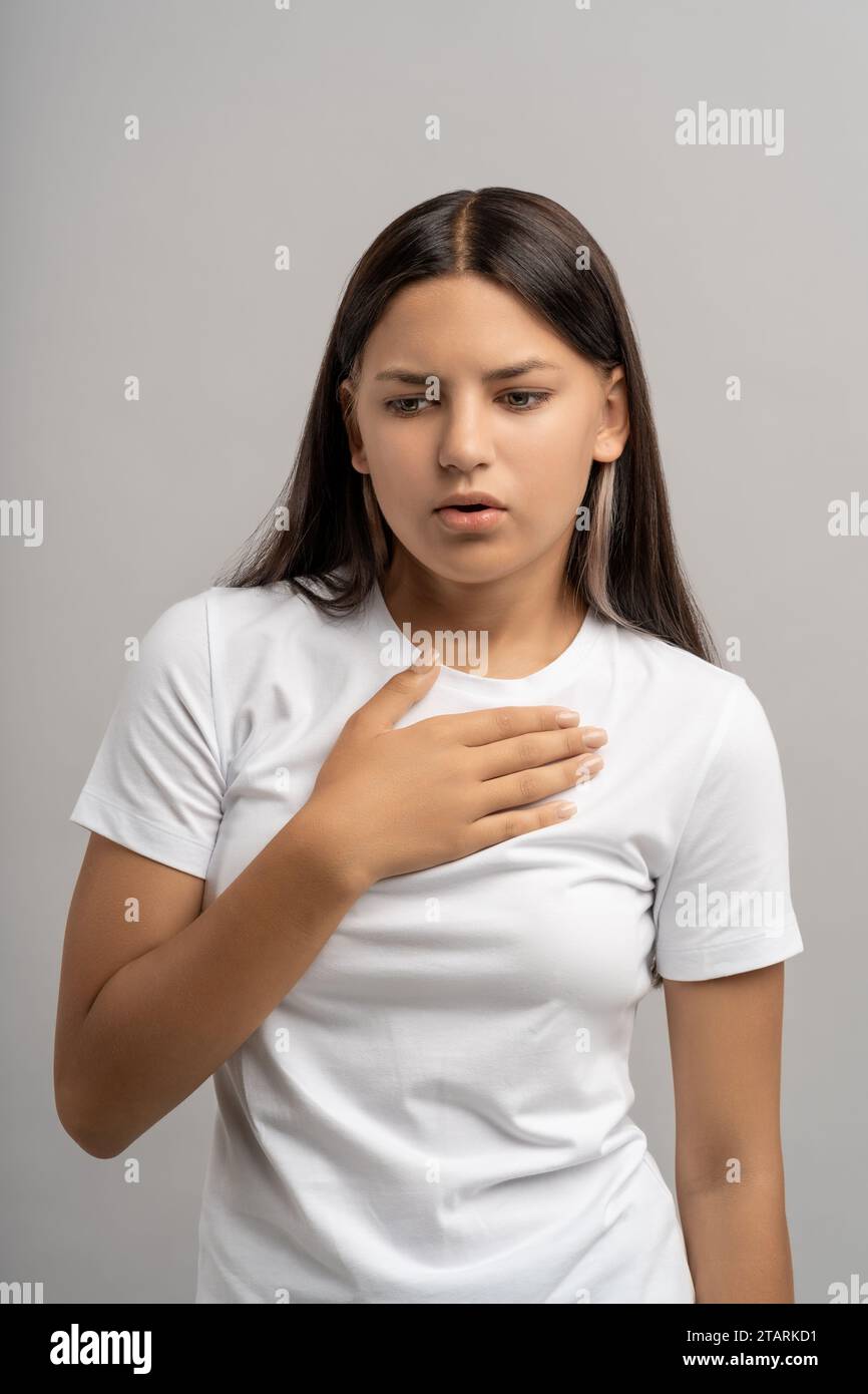 Teen girl suffer from breathing problems, panic attack, suffocation ...