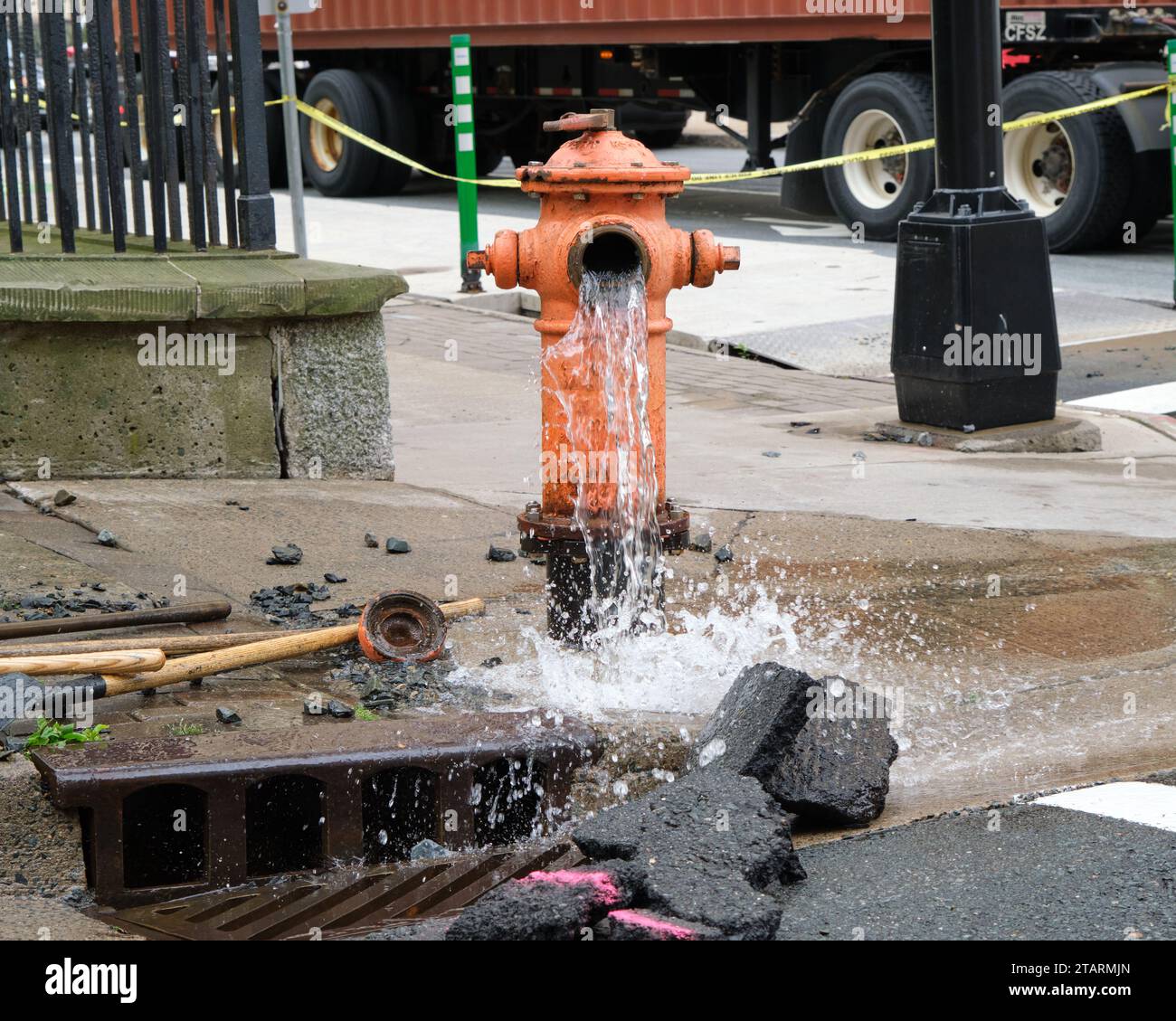 Fire hydrant gushing water after water mane collapse Stock Photo - Alamy