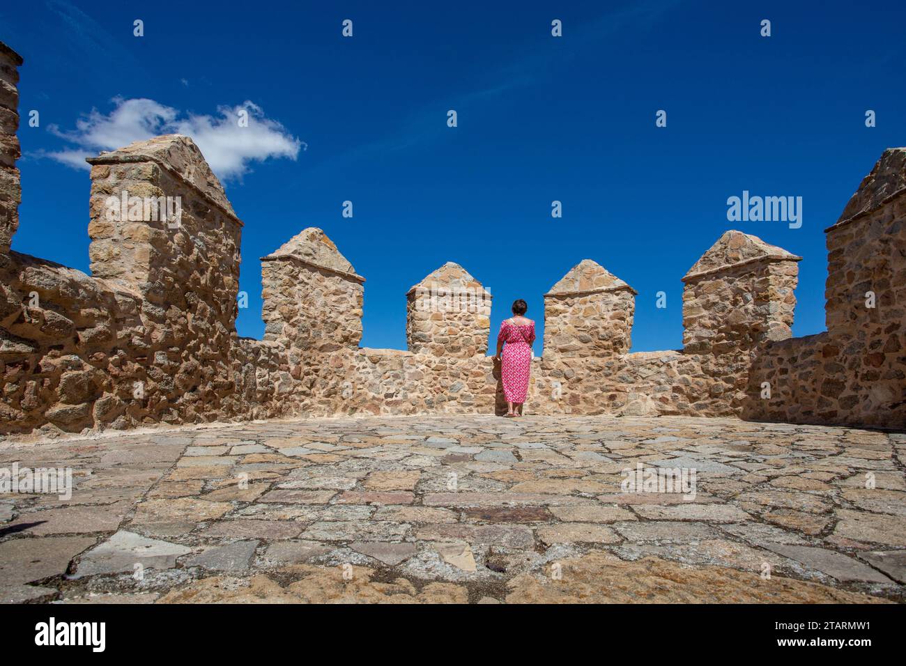Woman walking on the ramparts of the fortified city walls in the ...