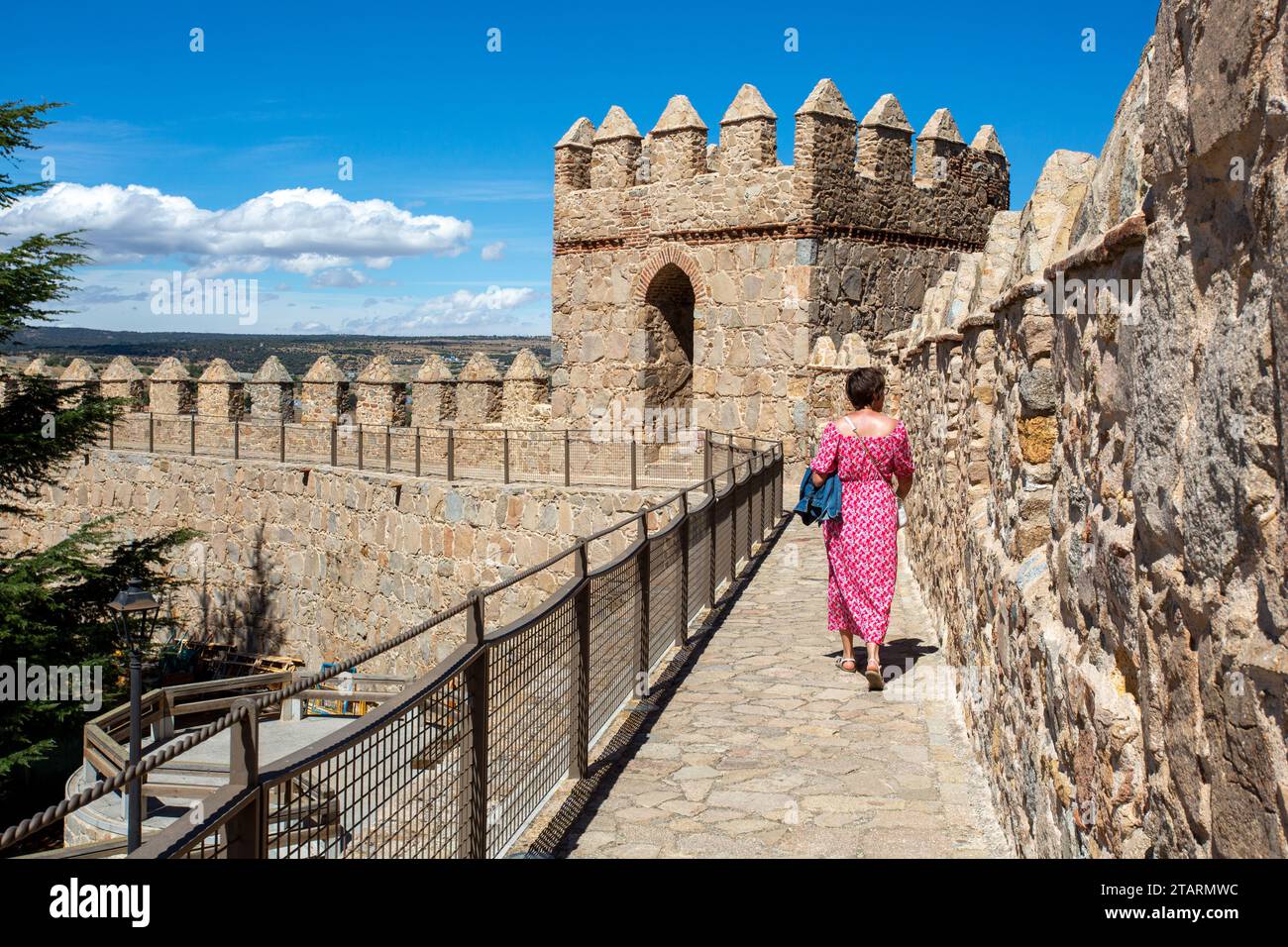 Woman walking on the ramparts of the fortified city walls in the ...