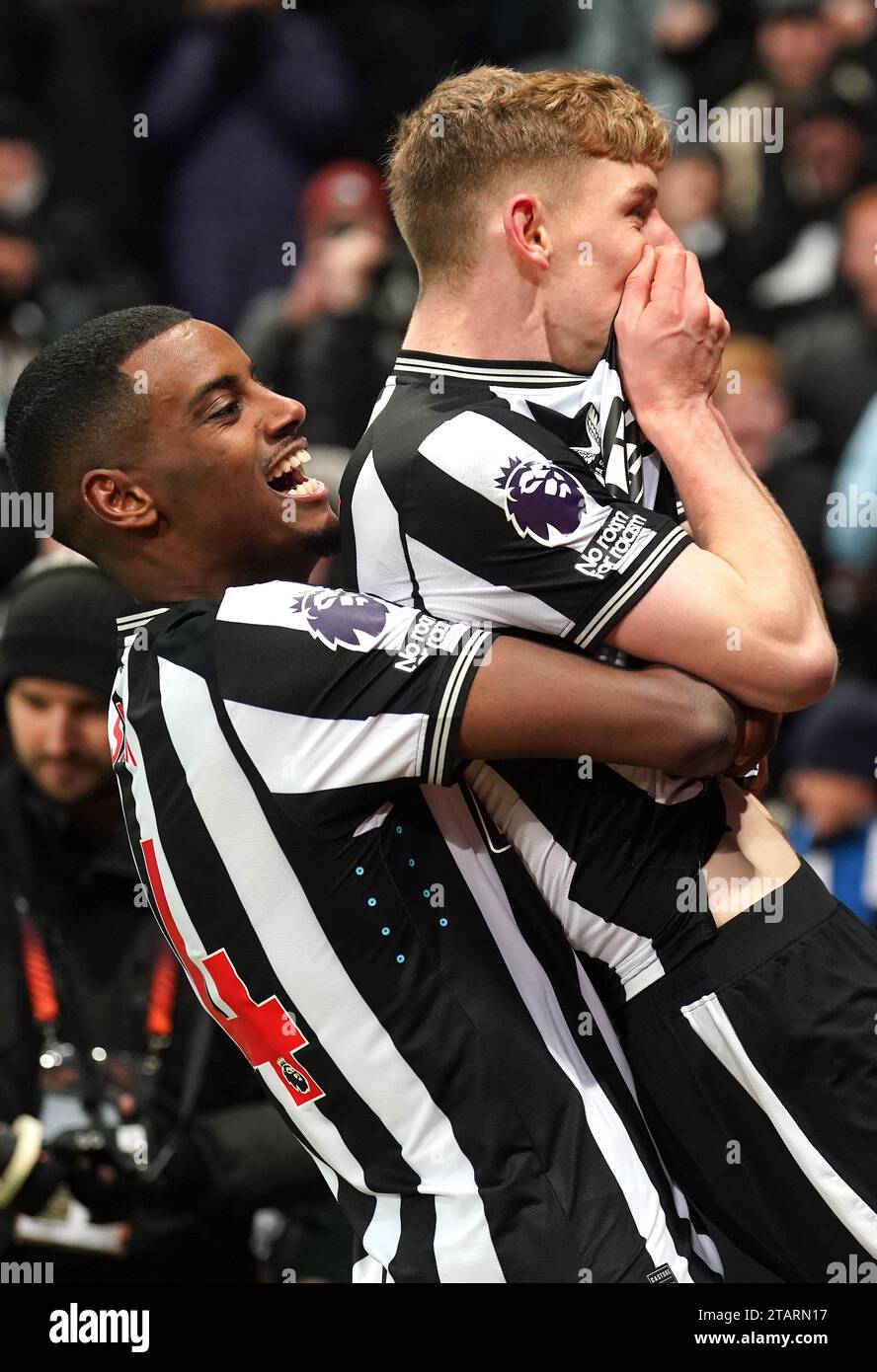 Newcastle United's Anthony Gordon (right) celebrates scoring their side ...