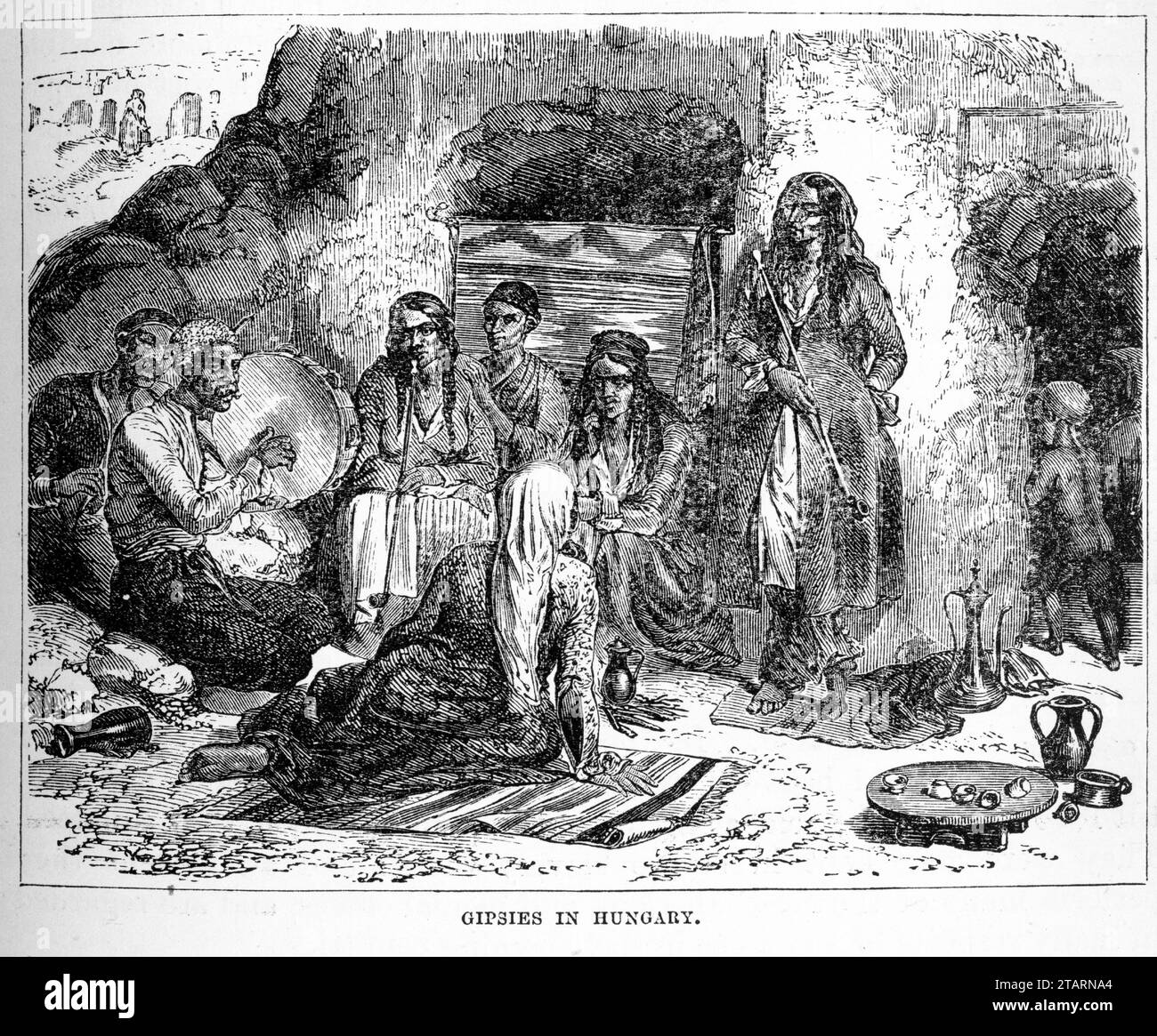 Engraving of a Gypsy family in Hungary, wearing traditional costumes ...