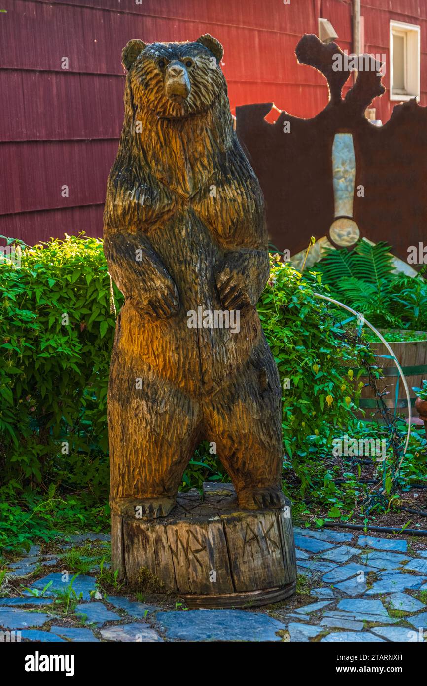 Carved wooden Bear statue standing in a courtyard in Anchorage, Alaska ...
