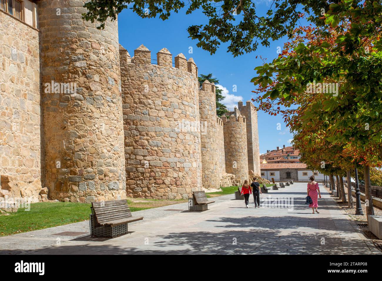 People walking by the ramparts of the fortified city walls in the ...
