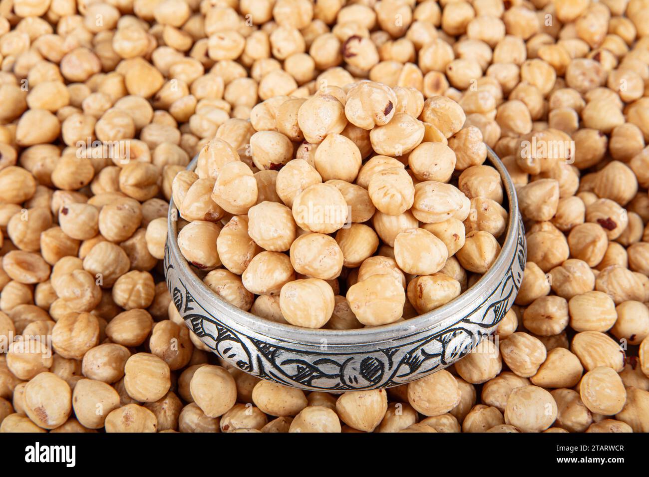 Pile of roasted nuts on white background. Hazelnuts harvest. Filbert ...