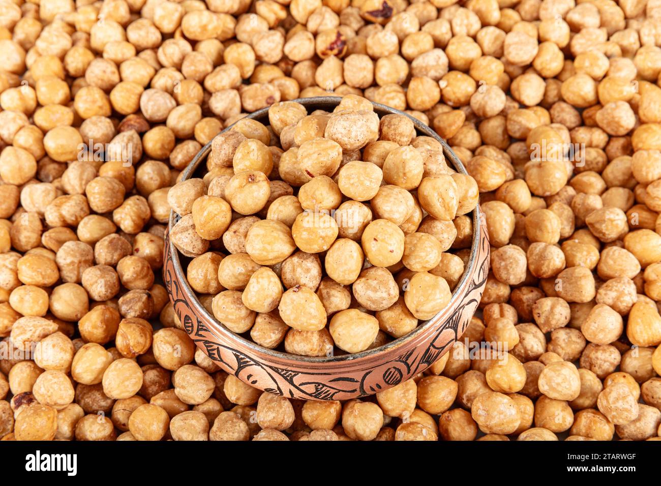 Pile of roasted nuts on white background. Hazelnuts harvest. Filbert ...