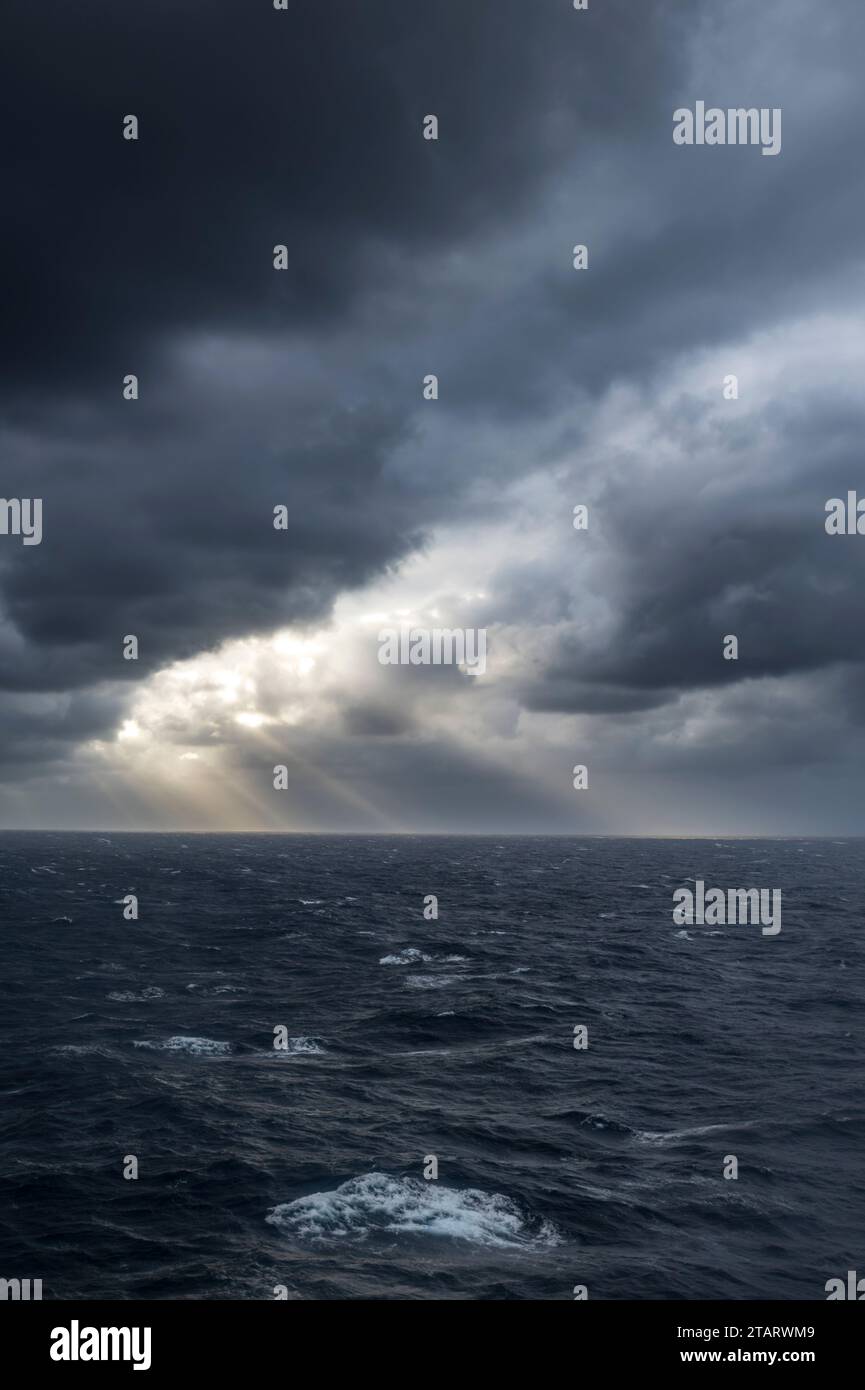 Sun shining through Ocean Storm Stock Photo - Alamy