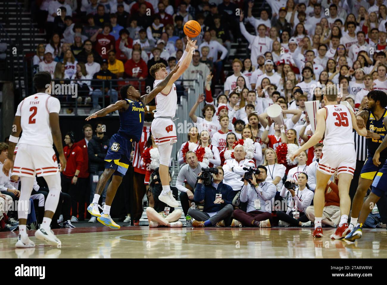 Madison, WI, USA. 2nd Dec, 2023. Wisconsin Badgers guard Max Klesmit ...
