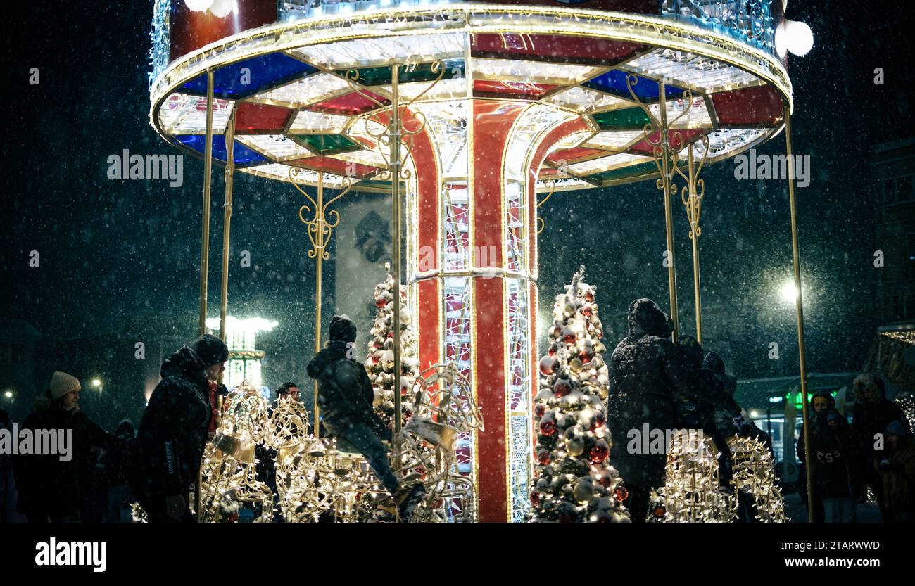 Christmas carousel with kids having fun Stock Photo - Alamy