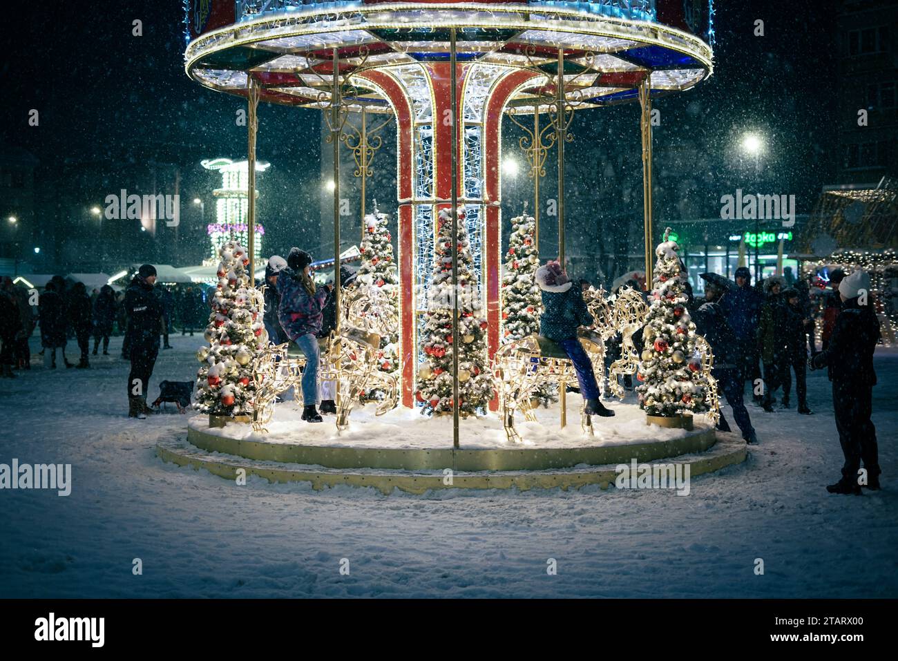 Christmas carousel with kids having fun Stock Photo - Alamy