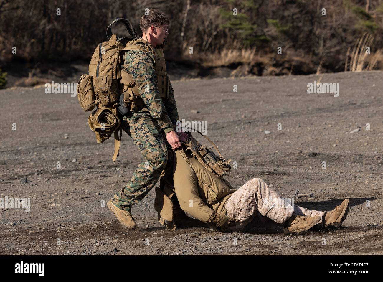 U.S. Navy Seaman Apprentice Kyle Wilcox drags a simulated casualty for ...