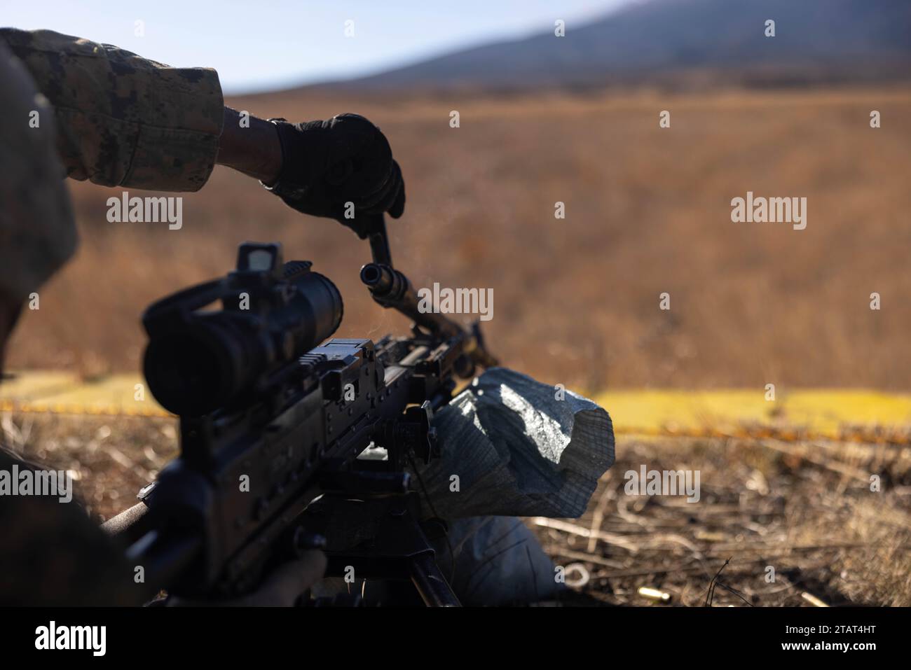 A U.S. Marine changes the barrel of an M240B machine gun during ...