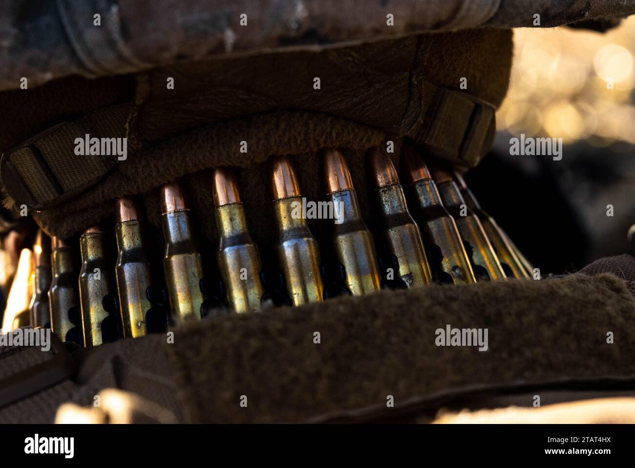 A U.S. Marine retains ammunition for an M240B machine gun during ...