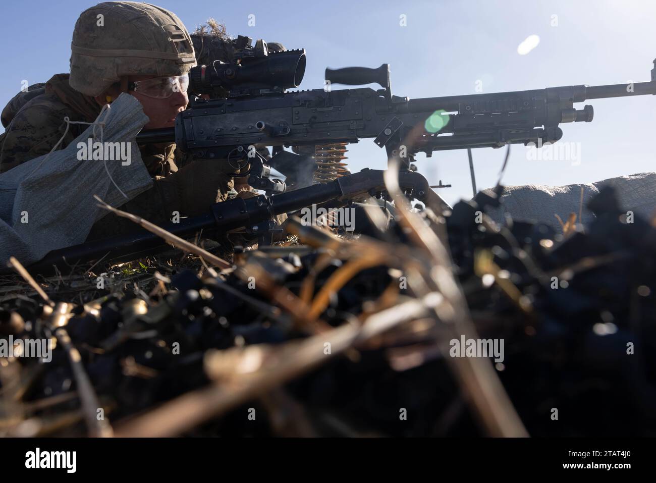 A U.S. Marine fires an M240B machine gun during Artillery Relocation ...