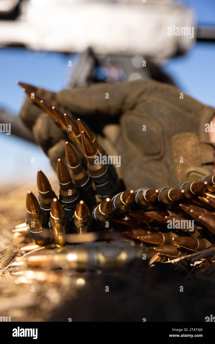 U.S. Marine Corps Lance Cpl. Rolando Romero prepares to load an M240B ...